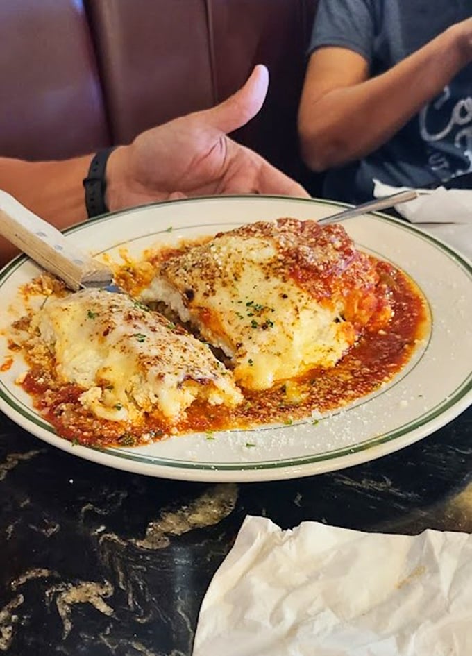 Someone's Italian grandmother would approve of this lasagna—layers of cheese stretching skyward with each forkful like a delicious magic trick.