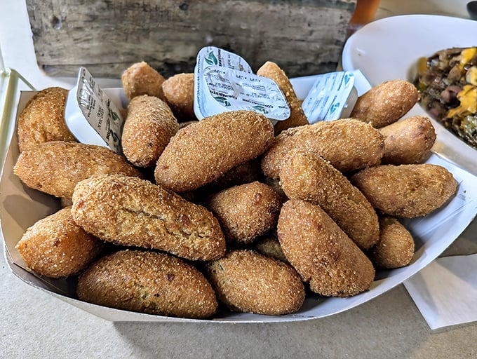 Hush puppies so golden and perfect, they make Southern grandmothers nod in approval. Crispy outside, tender inside—the ideal seafood sidekick.