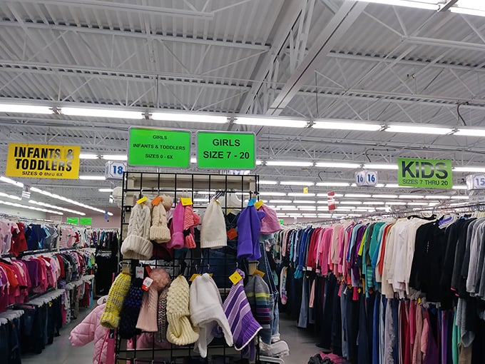 The children's section: where outgrown clothes find new adventures and parents find budget salvation. Those tiny winter coats won't stay tiny for long.
