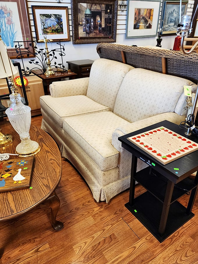 That cream-colored loveseat isn't just furniture—it's the beginning of your living room's redemption story. The framed artwork behind completes the transformation.