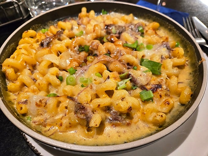 Mac and cheese that's had a glow-up. Creamy, cheesy pasta studded with mushrooms and green onions—comfort food that went to finishing school. 