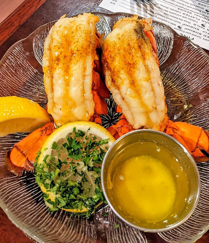 Florida lobster tails split and broiled to sweet perfection. The drawn butter isn't just a condiment—it's a commitment to indulgence.