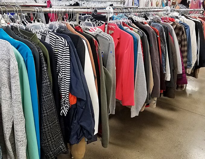 The clothing racks stretch out like a textile rainbow – each hanger a potential "where did you get that?" conversation starter.