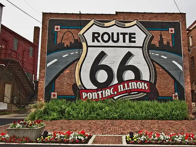 This isn't just street art—it's Pontiac's billboard to the world. The Route 66 shield mural has probably appeared in more vacation photos than most celebrities.