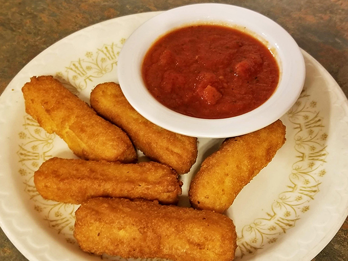 Golden mozzarella sticks with that perfect pull-apart cheese stretch – the kind that makes everyone at the table pause their conversation to watch.