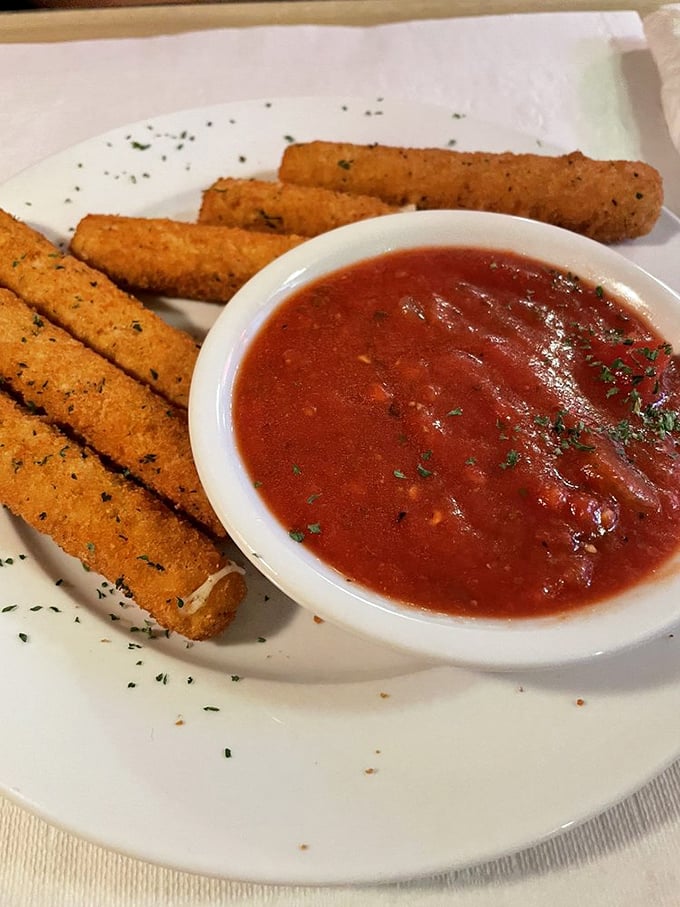 These aren't just mozzarella sticks—they're golden-brown torpedoes of cheese with a marinara sidekick that makes dipping an art form.
