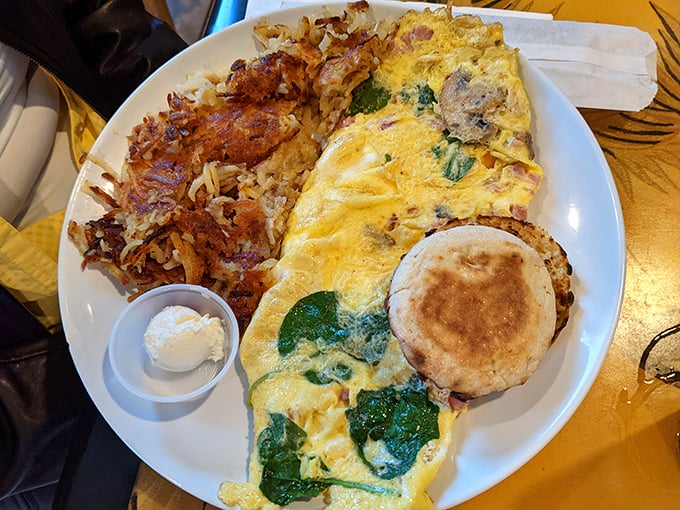 This isn't just an omelet – it's a golden envelope delivering a love letter of spinach, cheese and perfectly seasoned fillings.