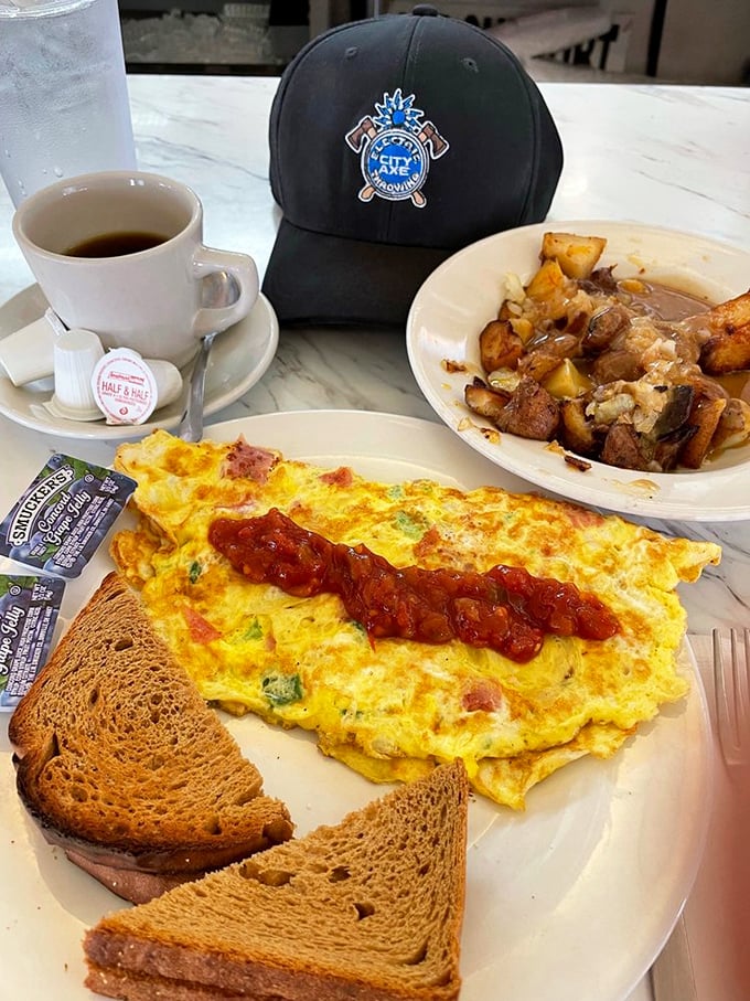 Breakfast perfection on a plate: an omelet that's seen things, home fries with attitude, and toast that knows its supporting role.