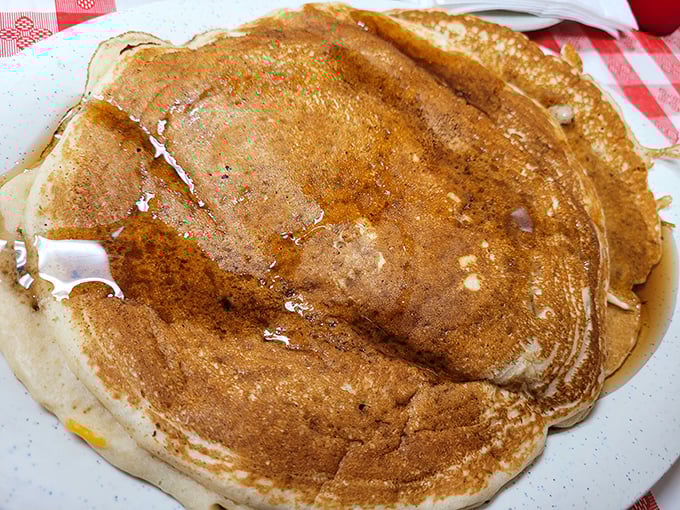 Pancakes so golden they belong in Fort Knox. These fluffy discs of joy are what breakfast dreams are made of – no alarm clock required.