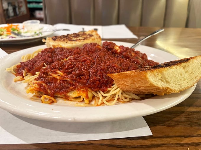 Spaghetti with meat sauce and garlic bread that would make any Italian grandmother nod in approval. Simple, hearty, and absolutely satisfying.