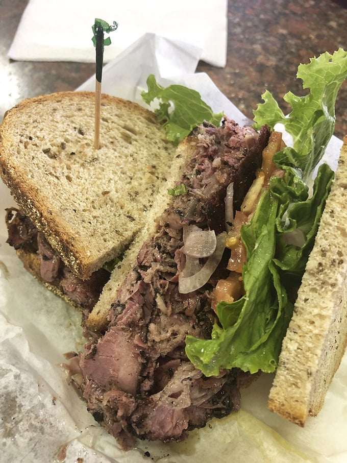This pastrami masterpiece has more layers than a Shakespearean tragedy. The meat-to-bread ratio achieves that elusive deli harmony we all seek in life.