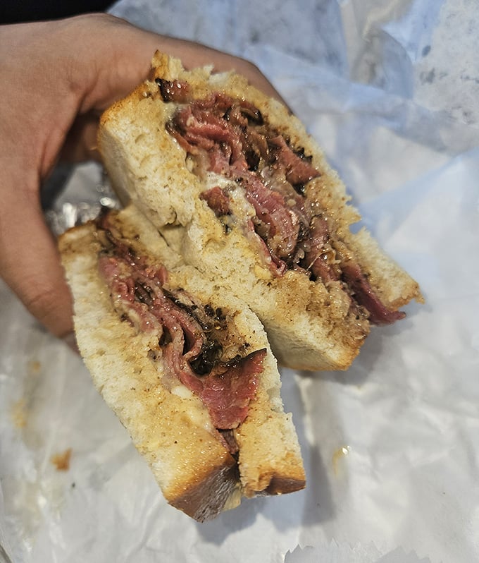 This isn't just a sandwich—it's architecture. The structural integrity of those bread slices supporting that glorious meat deserves an engineering award.