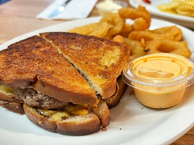 This patty melt whispers sweet nothings to your taste buds—crispy bread, melty cheese, and a burger patty that's lived a good, flavorful life. 