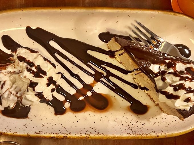 Dessert architecture at its finest. That chocolate drizzle isn't random—it's Jackson Pollock meets pastry chef in a sweet collaboration.