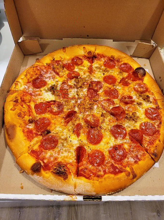 Pizza perfection doesn't need fancy toppings – just a golden crust, melted cheese, and pepperoni that curls into little cups of flavor-holding goodness.