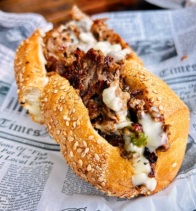Philly's iconic sandwich gets the royal treatment here – tender meat, caramelized onions, and cheese that stretches like your favorite sweatpants after Thanksgiving dinner.