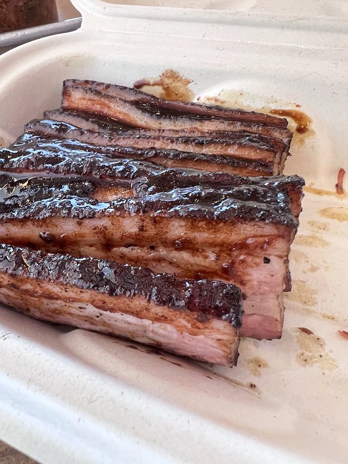 Pork belly that glistens with promise. Each layer tells a different story—crispy, fatty, meaty—a trilogy of pure satisfaction.
