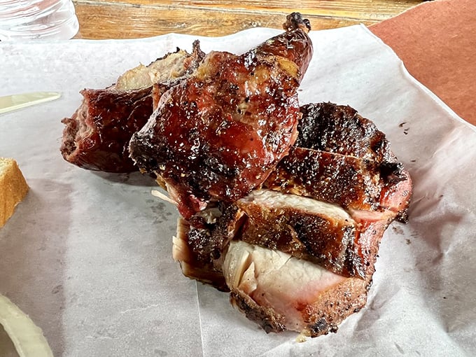 Smoked chicken that makes you question everything you thought you knew about poultry – gloriously burnished skin hiding meat so juicy it's practically indecent.