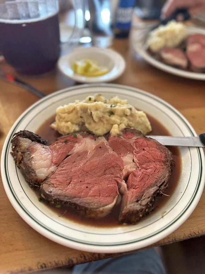 Prime rib so perfectly cooked it deserves its own Instagram account. Those mashed potatoes aren't just a side—they're the supporting actor in this meaty drama.