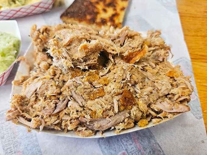This isn't just pulled pork—it's Eastern Carolina poetry on a plate, each strand telling a story of smoke, time, and tradition.
