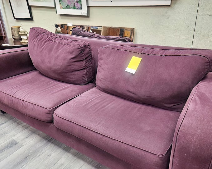 Purple reign! This plush sofa isn't just furniture—it's a statement piece that would make Prince nod in approval.