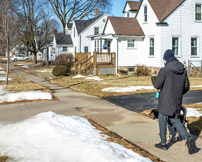 Winter in Wisconsin neighborhoods means that perfect balance of snow-dusted lawns and cleared sidewalks—a testament to Midwestern efficiency and neighborly consideration.