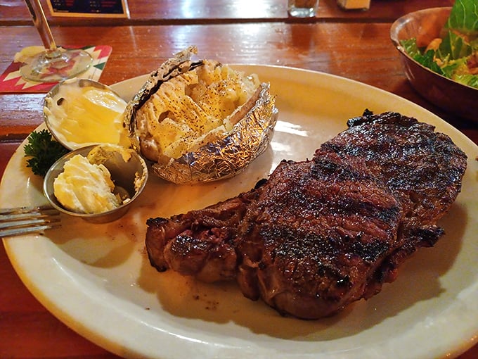 This isn't just a steak—it's a statement. A perfectly cooked ribeye with a baked potato that's dressed for the occasion.