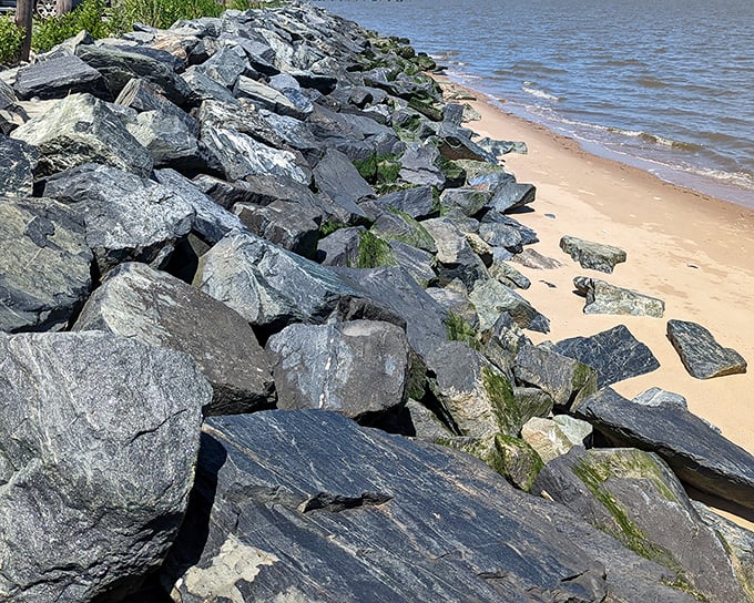 Nature and engineering in perfect harmony—these weathered stones protect the shoreline while creating their own rugged beauty.