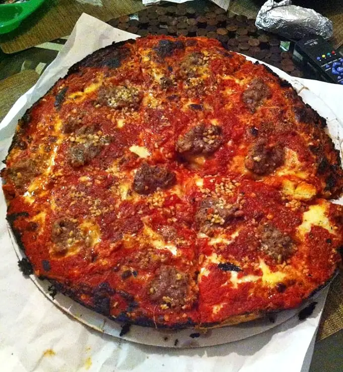 The sausage pizza features hand-placed chunks, not those sad factory pellets. Each bite delivers a perfect meat-to-cheese ratio.