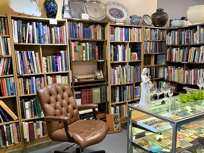 A bibliophile's dream corner complete with leather chair—because time disappears when surrounded by stories waiting to be rediscovered.