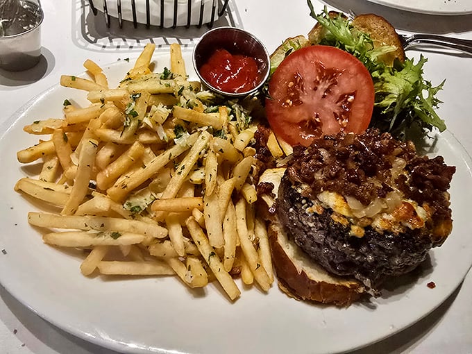 This burger isn't just a meal, it's an architectural achievement—with parmesan fries standing guard like delicious sentinels.