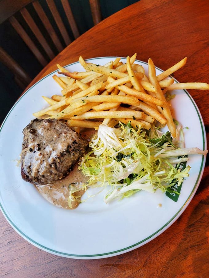 Steak frites done right—a perfectly cooked piece of beef alongside golden fries and a bright salad. The French really do understand the concept of balanced indulgence.