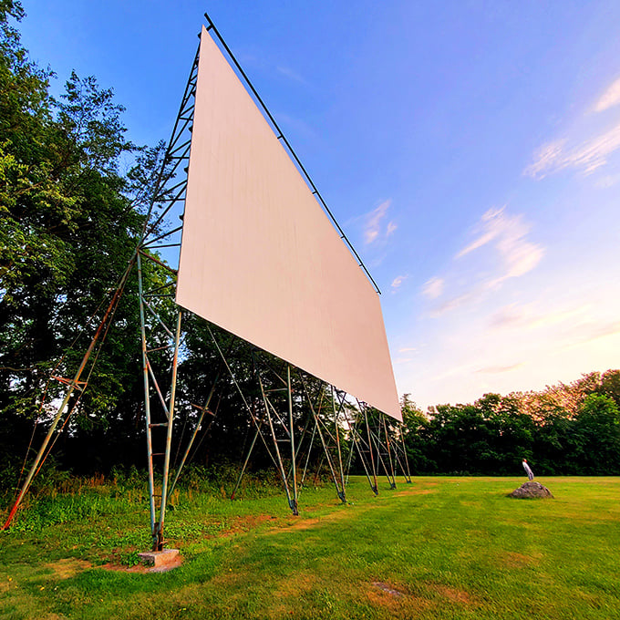 The engineering marvel that is the drive-in screen, standing tall against the Pennsylvania sky like a monument to simpler entertainment.