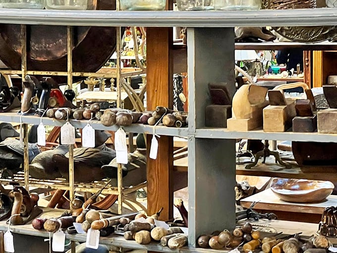 Wooden mallets and forgotten tools line these shelves, each with the patina of purpose and stories of craftsmen past.