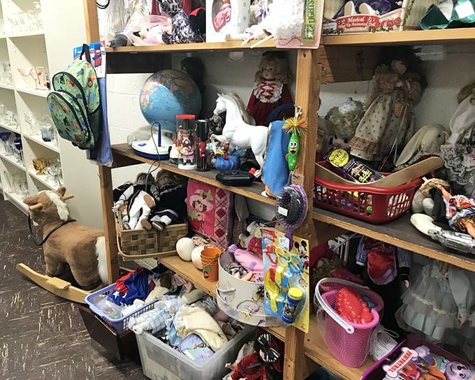 Childhood memories stacked floor to ceiling – dolls, stuffed animals, and that globe promising adventures to faraway places.