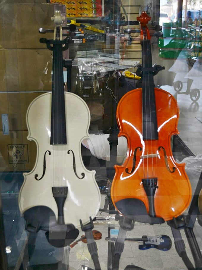 Classical beauty in white and orange. These violins aren't just instruments—they're gateways to cultural expression waiting for the right hands.