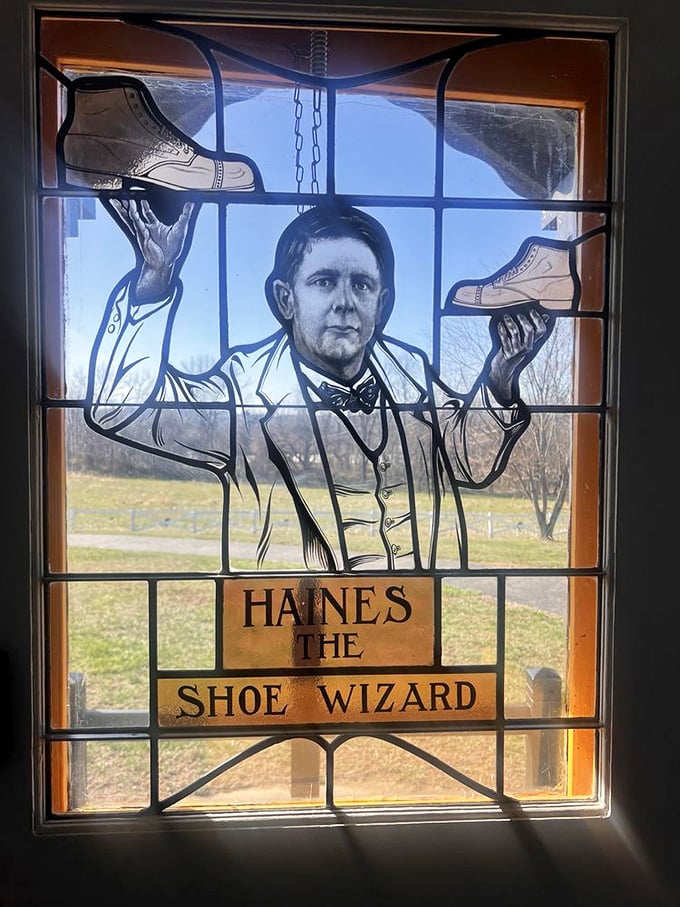 Stained glass windows depicting shoes within a shoe – it's like architectural inception with better lighting.