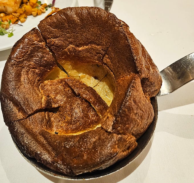 The Yorkshire pudding at Lawry's isn't dessert but a crater-like popover designed to soak up every last drop of that precious beef jus.