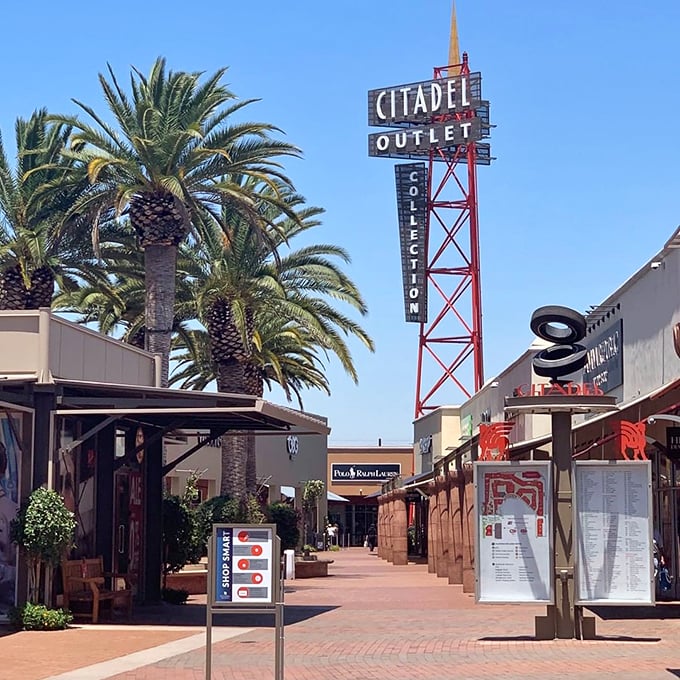 Citadel's iconic red tower stands tall against the blue California sky. Part shopping center, part architectural statement piece!