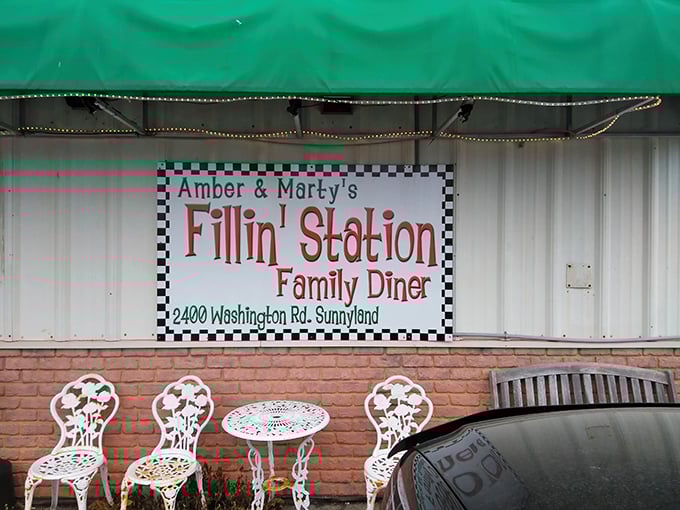 That checkered awning screams "pit stop paradise" - fuel up your tank and your belly here.
