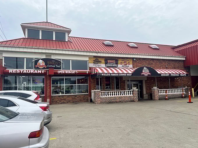 Red roof, striped awnings, and the promise of corned beef stacked higher than your expectations.