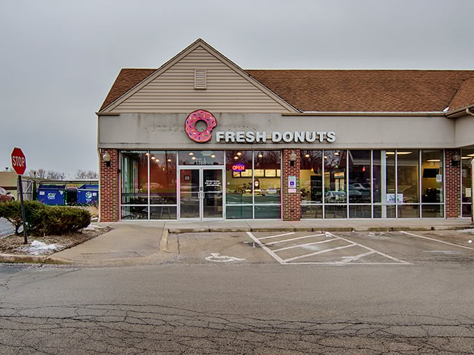 Fresh Donuts keeps it simple with their pink donut sign – a sweet promise of what awaits inside this unassuming strip mall gem.