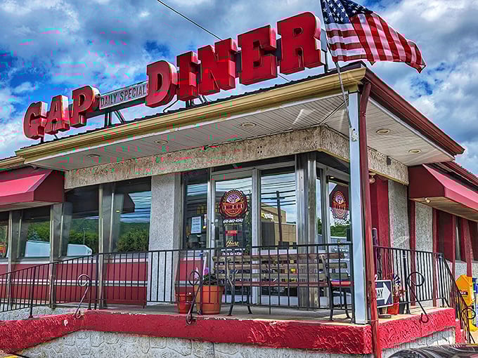 Bold red letters announce what your stomach already knows—you've found home-cooked heaven. That flag adds a patriotic touch to your pancake pilgrimage.