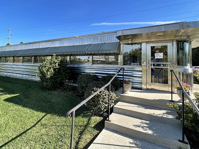 Joni's chrome exterior gleams like a silver breakfast spaceship that landed in Lake Geneva. This is diner architecture at its most magnificent.