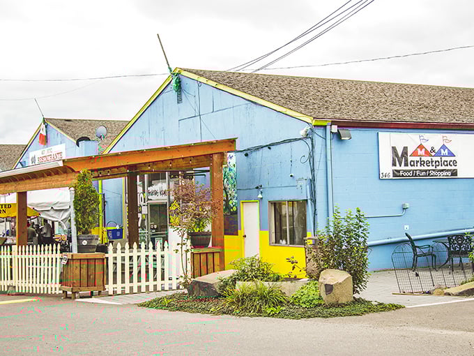 The cheerful blue exterior of M&M Marketplace invites shoppers to explore its treasure-filled halls. A Smurf village for serious bargain hunters!