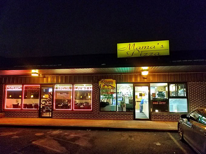 Mama's glows like a pizza lighthouse in the night – guiding hungry sailors to safe, delicious harbor.