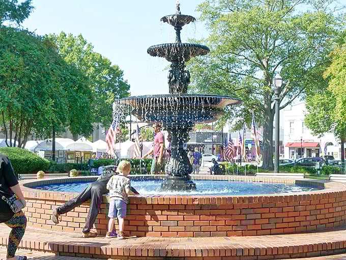 Marietta's fountain dances while shoppers promenade! This iron beauty has witnessed more first kisses than a high school prom chaperone.
