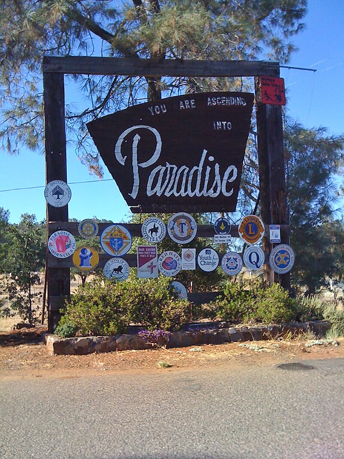 Paradise's welcoming sign reflects a community's resilient spirit and determination to rebuild better and more affordably than before.