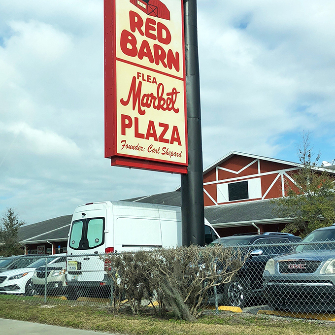 The classic Red Barn sign points to rustic charm where handpicked vendors showcase their finest treasures.