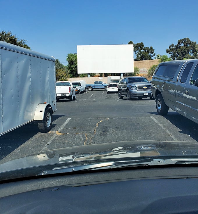 Daylight reveals Rubidoux's humble charm—this sun-baked asphalt will soon host a parade of minivans and pickup trucks seeking celluloid dreams.